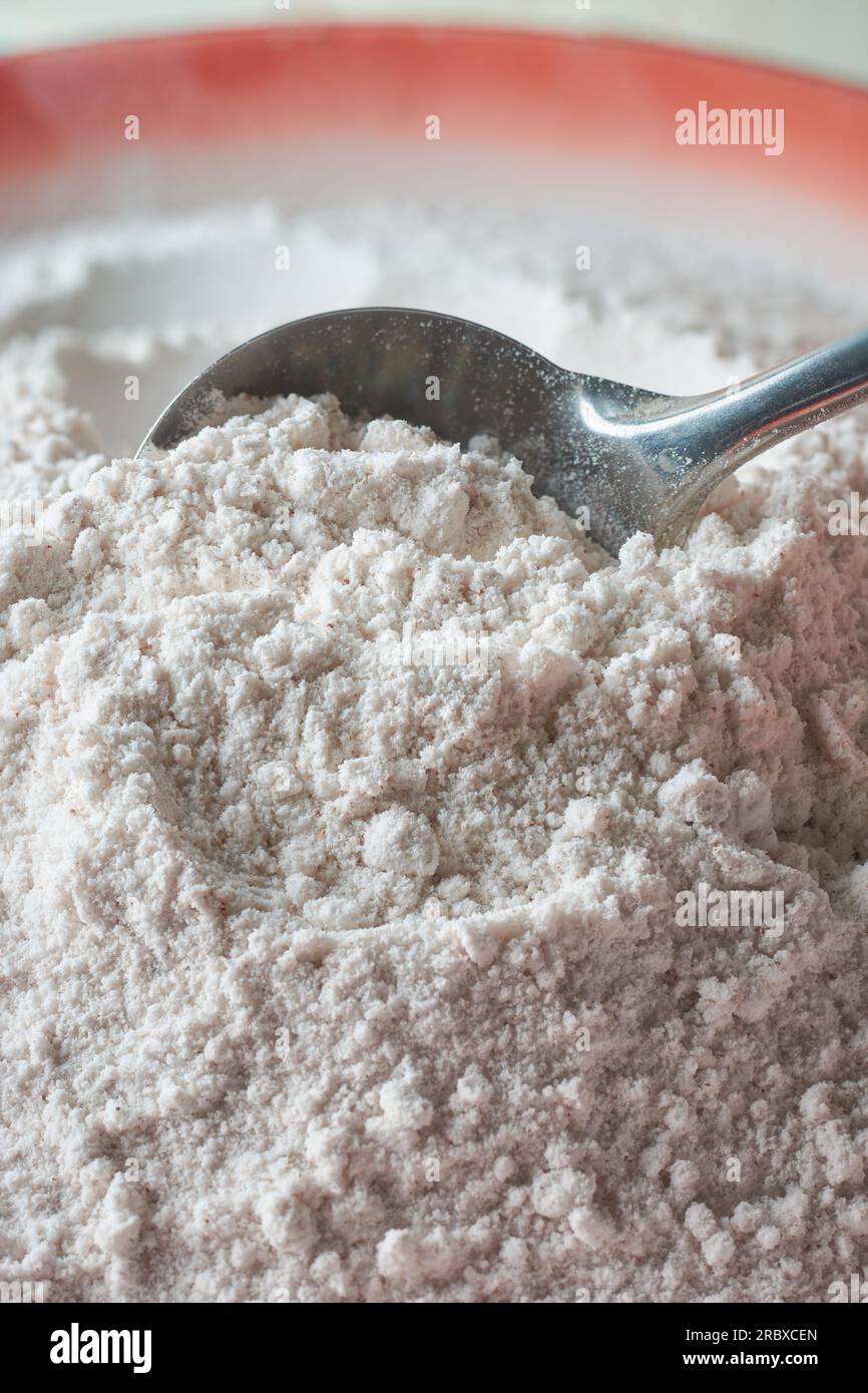 close-up view of rice flour with spoon, form of flour made from finely ...