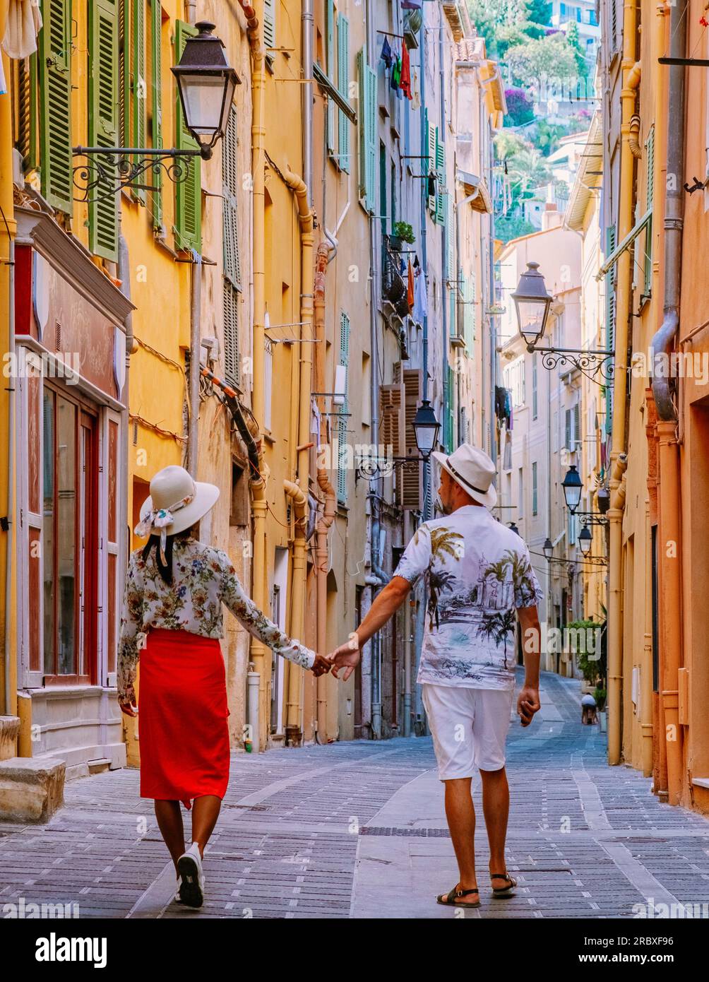 A couple of men and women on summer vacation in France visit the city ...