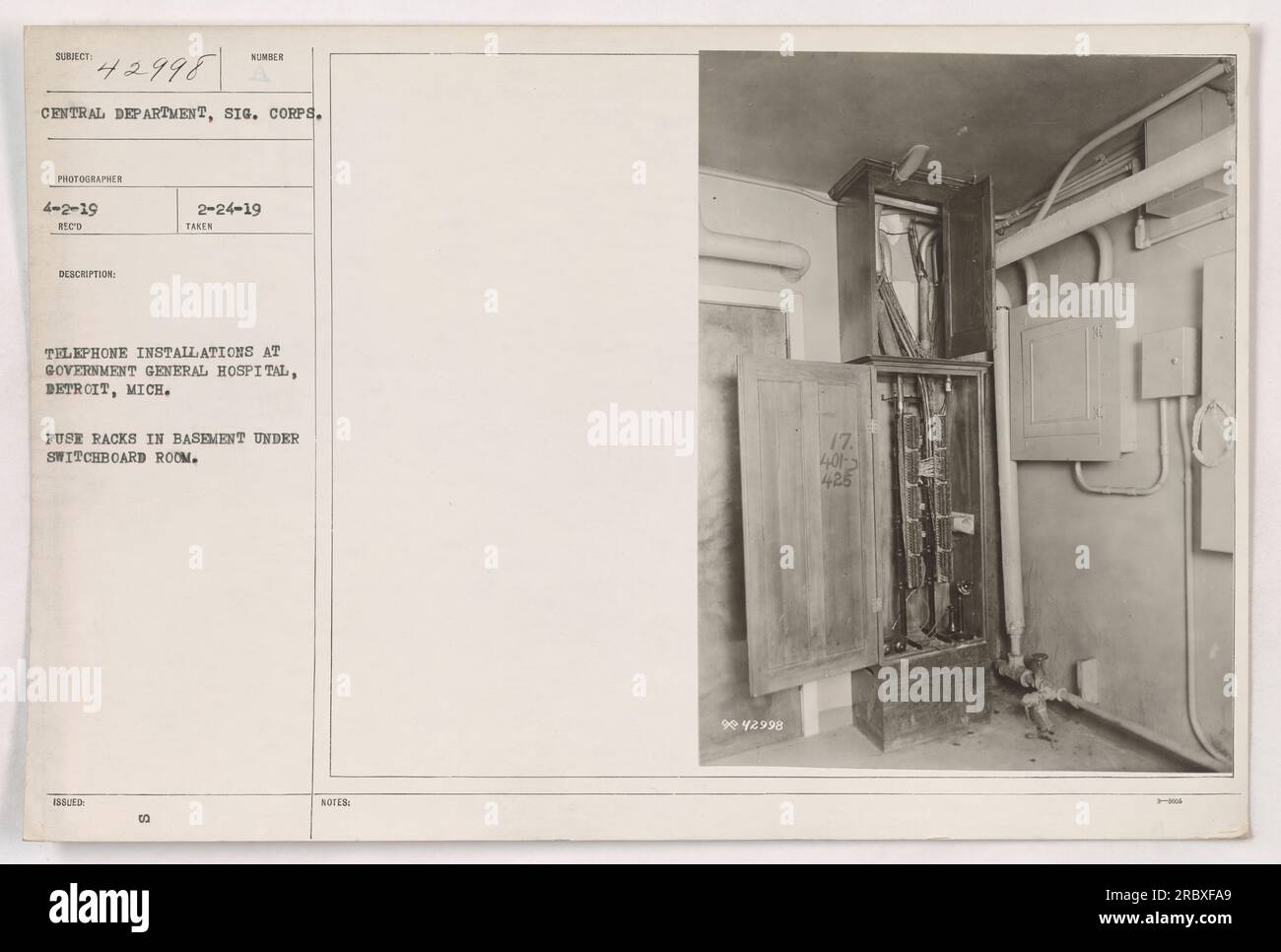 Soldiers are seen installing telephone racks in the basement of the ...