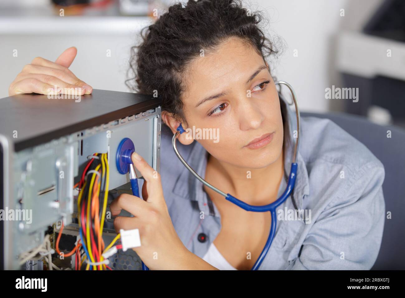 female computer examining by man with stethoscope Stock Photo - Alamy