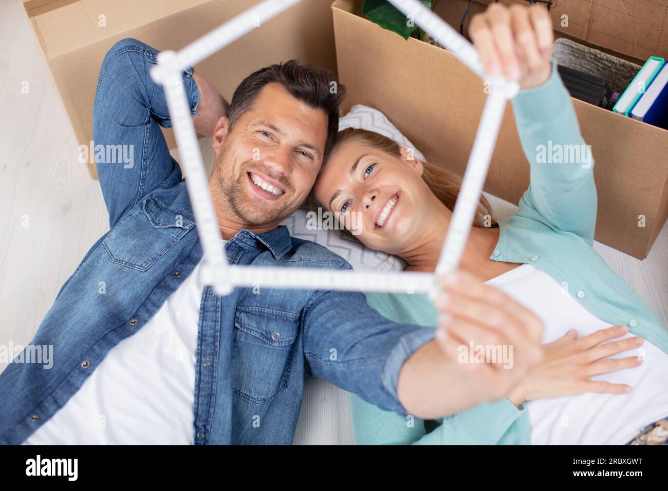 Happy family construction house teamwork hi-res stock photography and ...