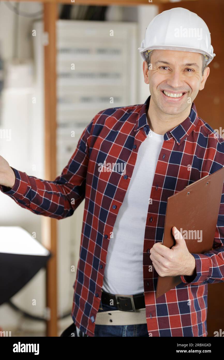portrait of handsome man in builders helmet Stock Photo - Alamy