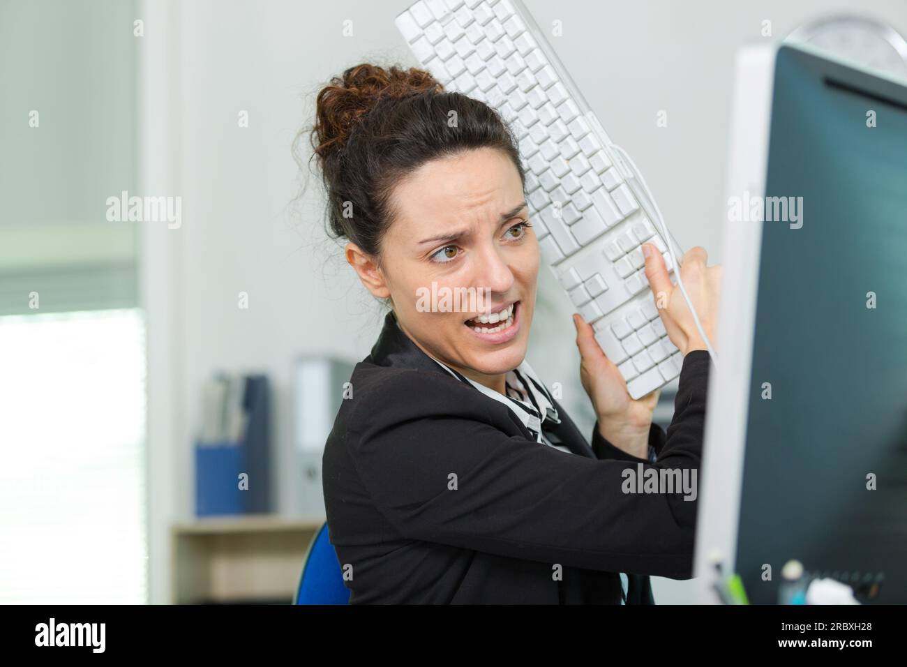 angry and stressed female worker in office Stock Photo - Alamy