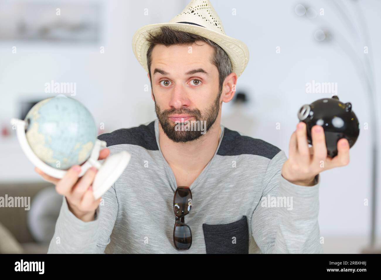 man not sure how to spend extra cash dollar bills Stock Photo - Alamy