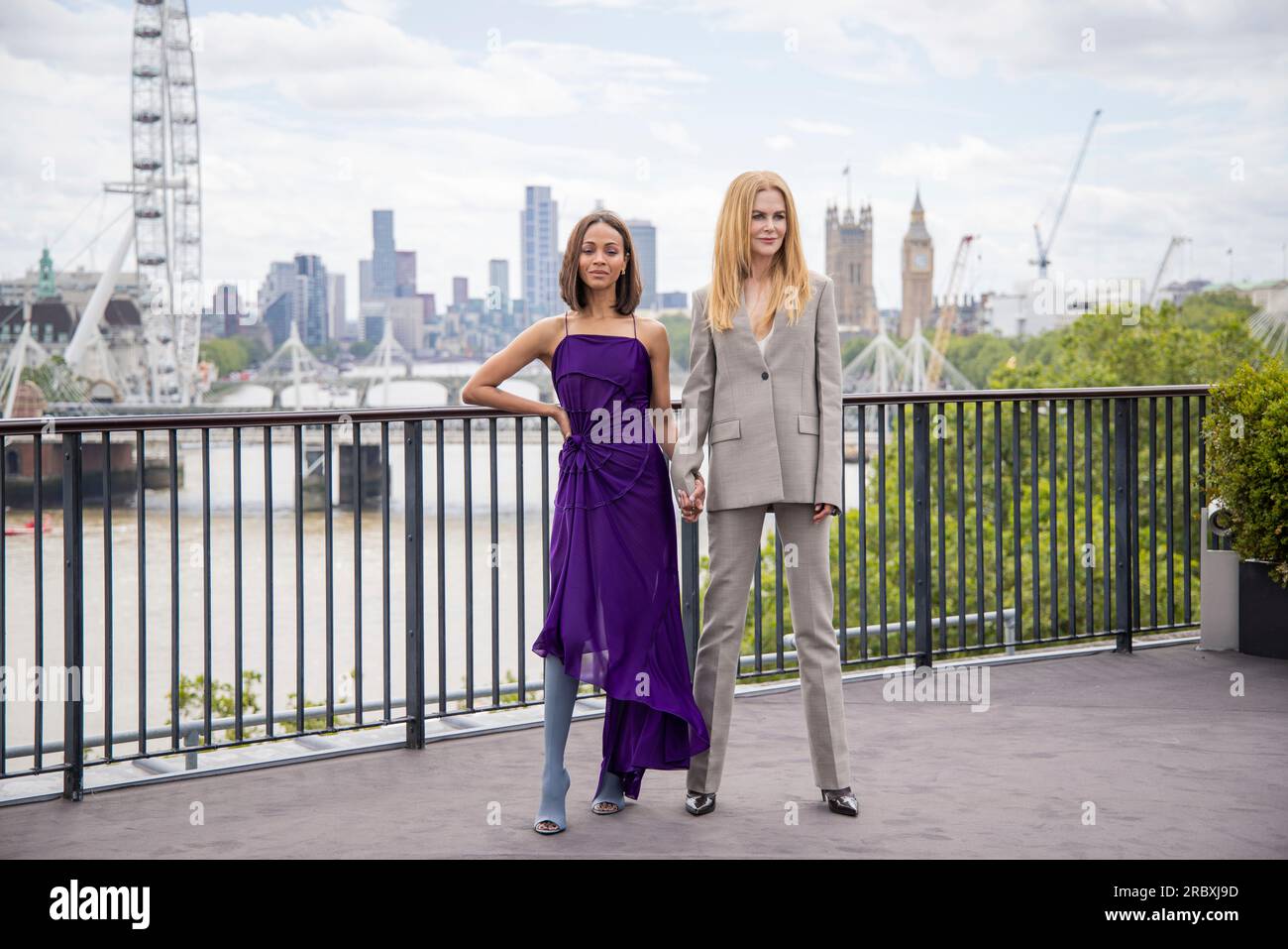 Zoe Saldana, left, and Nicole Kidman pose for photographers during a ...