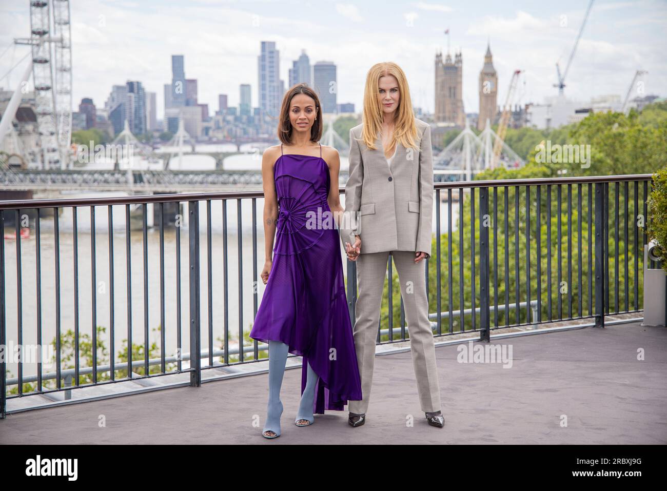 Zoe Saldana, left, and Nicole Kidman pose for photographers during a ...