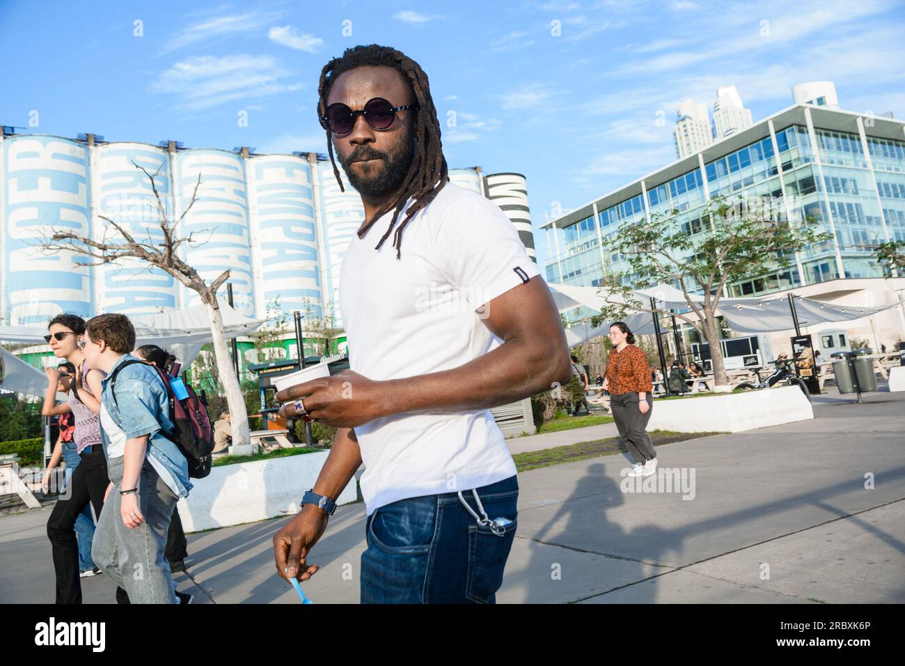 young black man with dreadlocks, looking at the camera with surprised ...