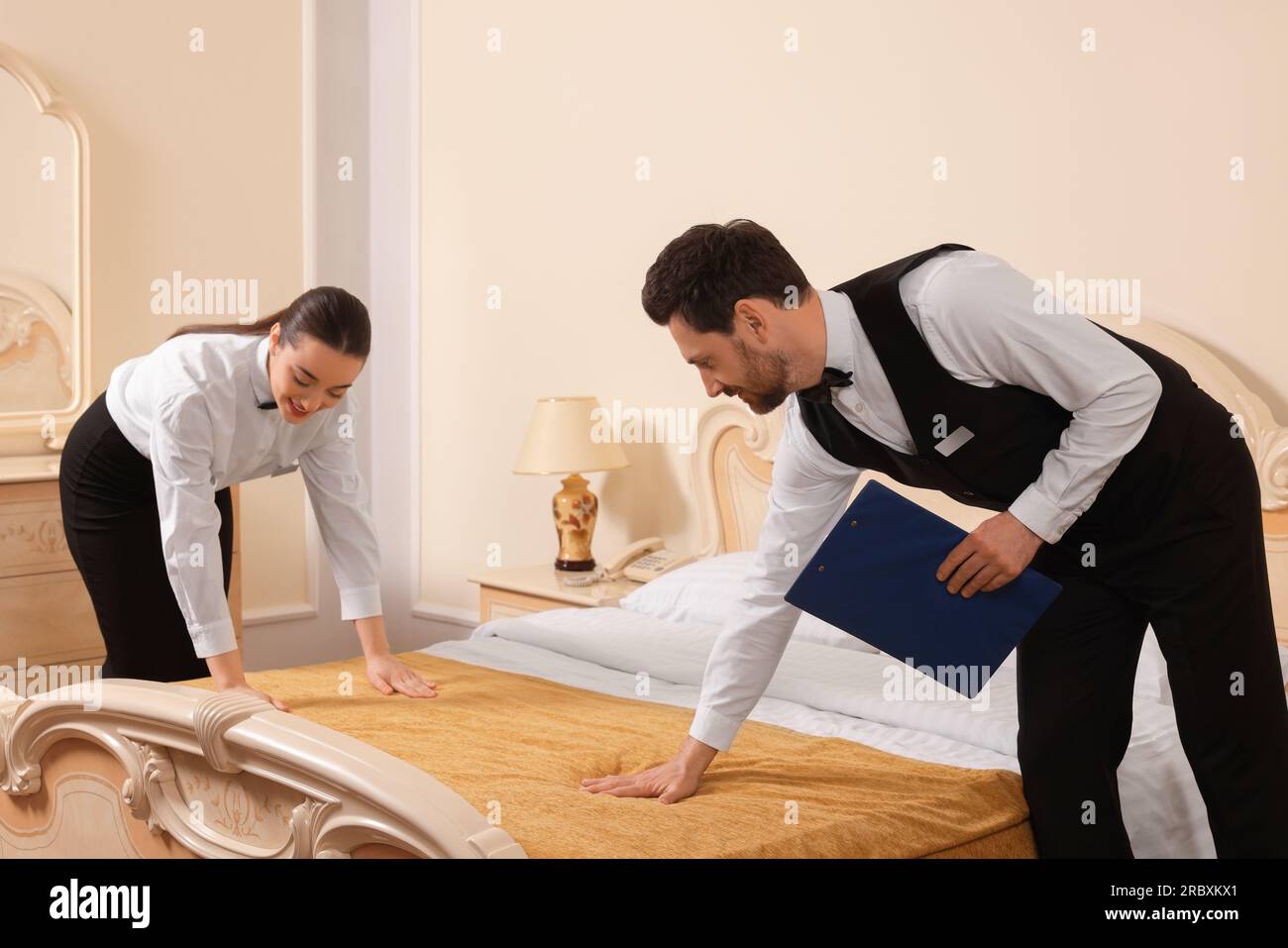 People attending professional butler courses in hotel Stock Photo - Alamy
