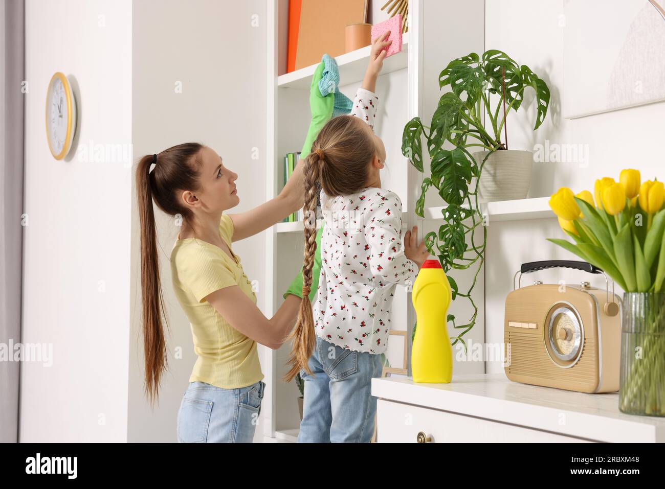 Child tidying up hi-res stock photography and images - Alamy