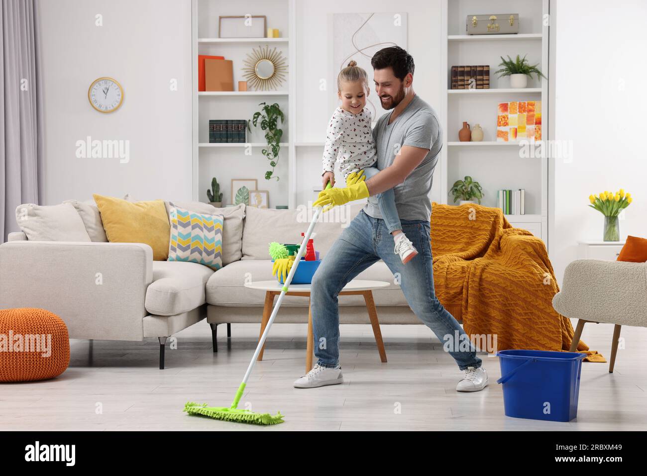 Tidying up at home with child hi-res stock photography and images - Alamy