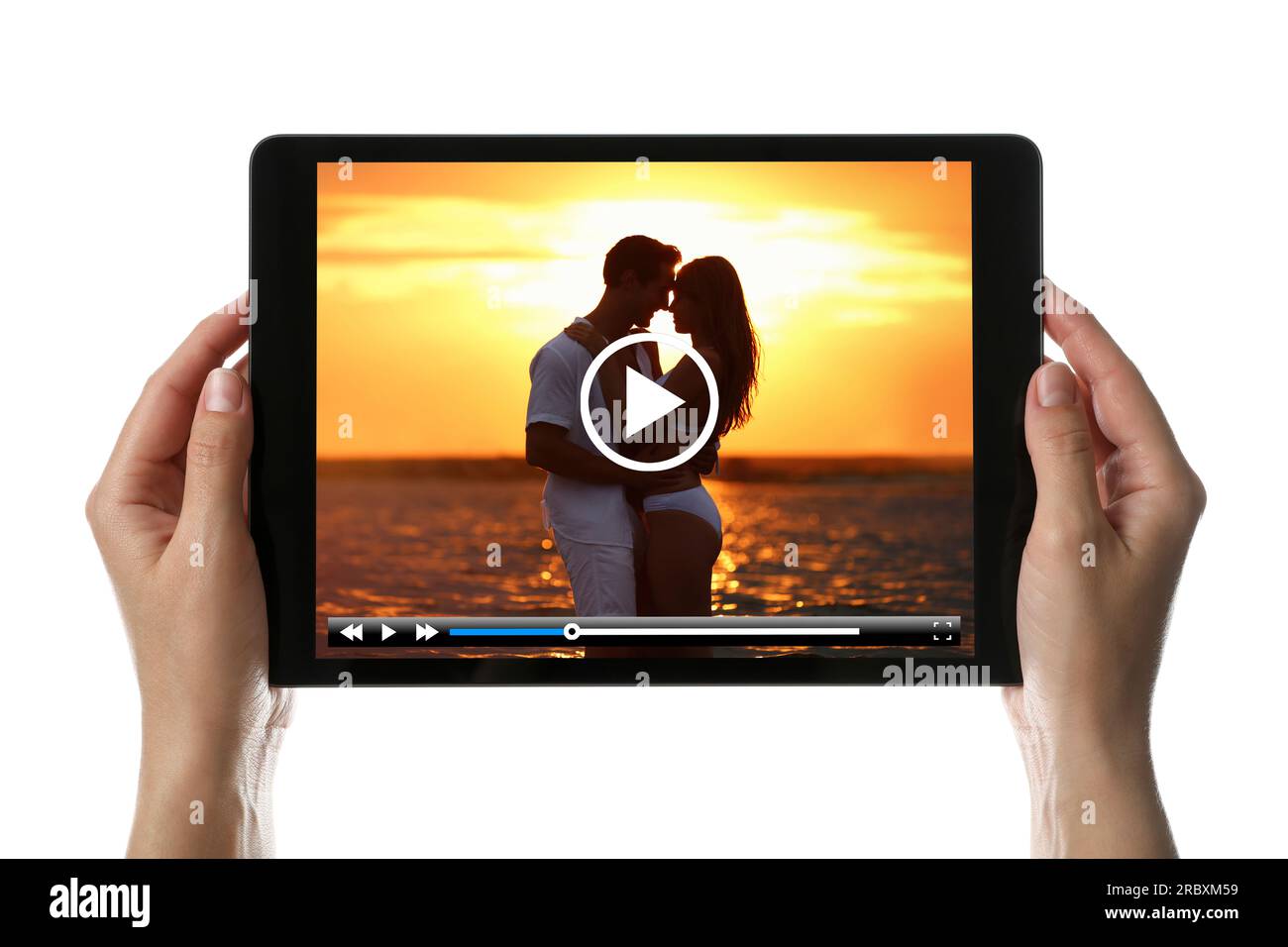 Couple watching tablet beach hi-res stock photography and images - Alamy
