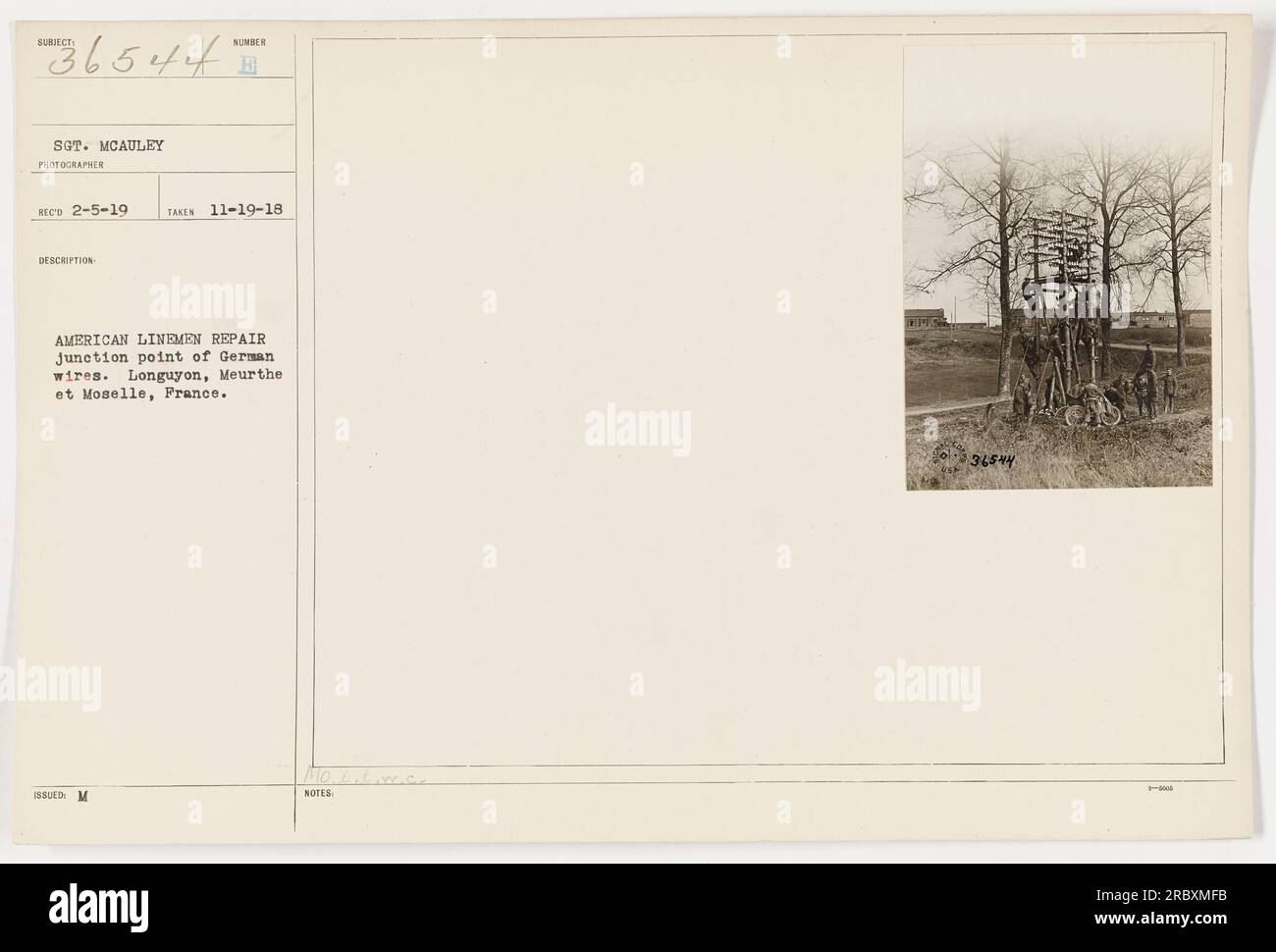 American linemen repairing a junction point of German wires in Longuyon ...