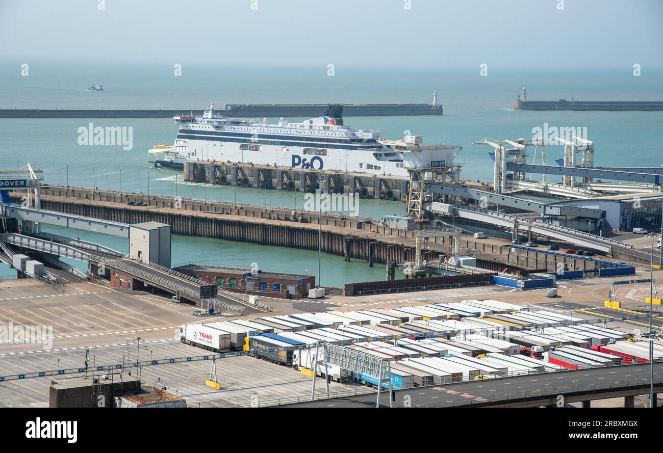 Trucks and ferries on port of Dover. Dover harbour connects Europe with ...
