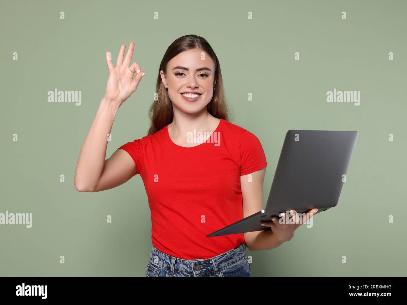 Student showing okay laptop hi-res stock photography and images - Alamy