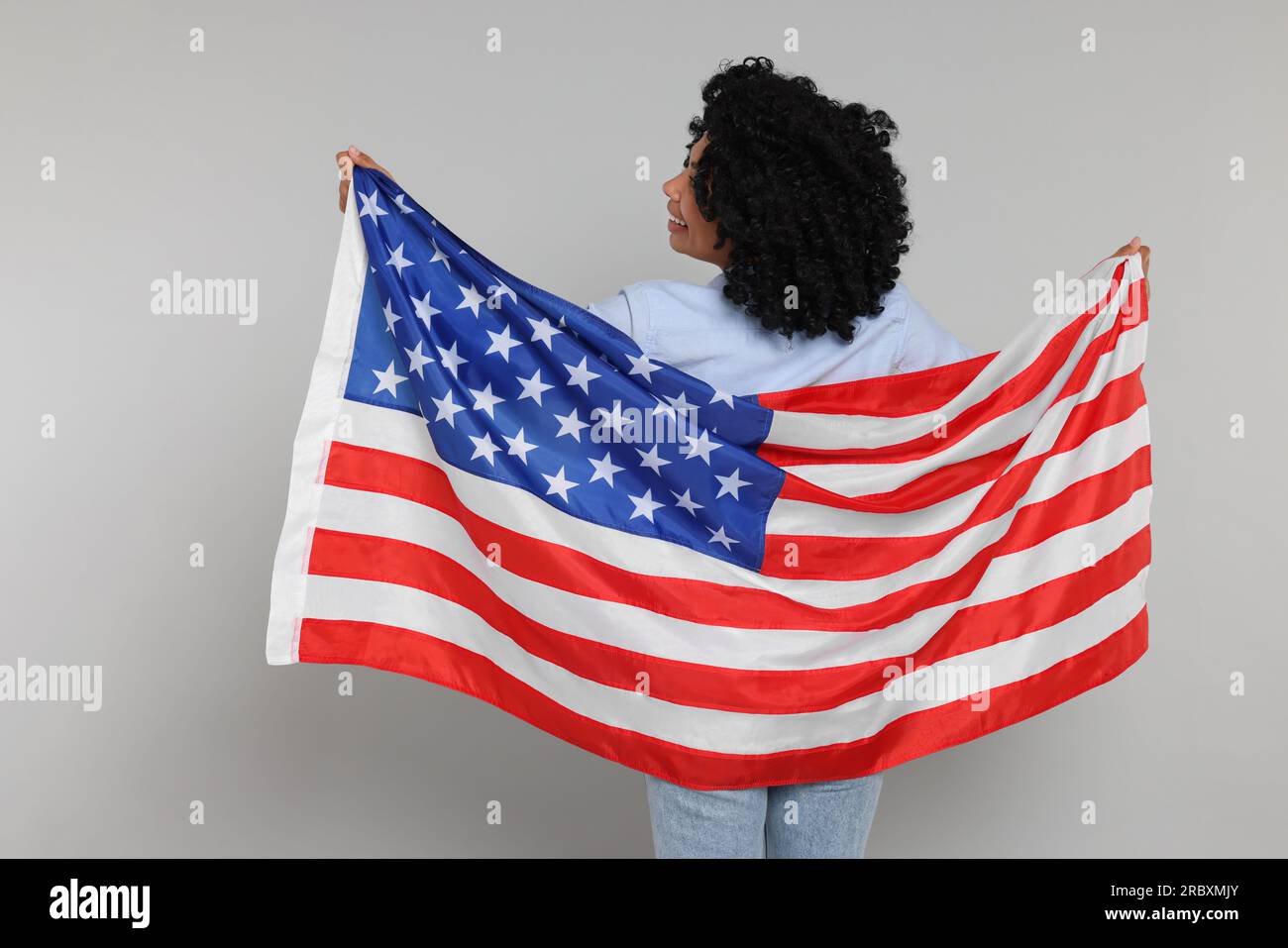 4th of July - Independence Day of USA. Happy woman with American flag ...