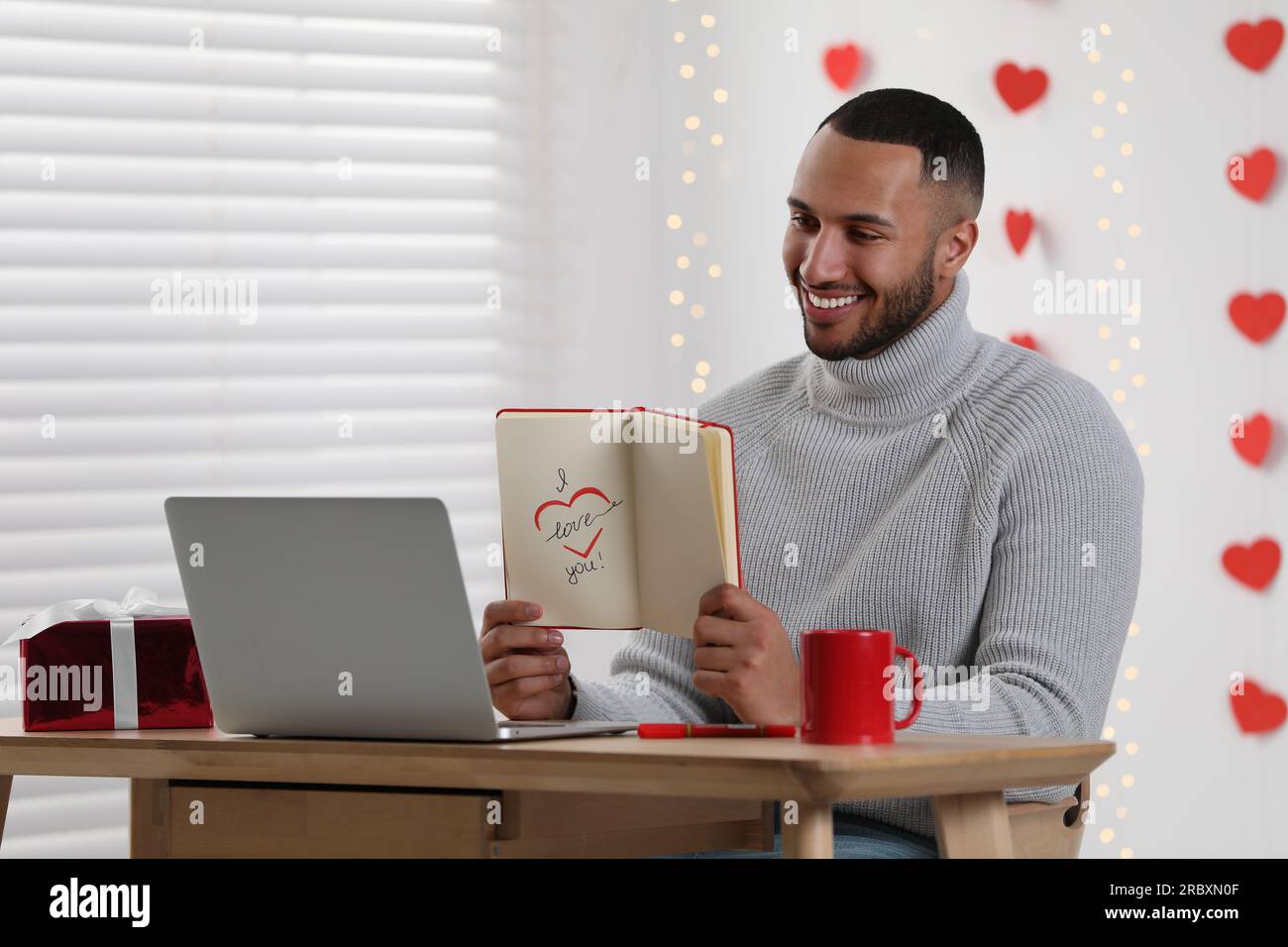 Valentine's day celebration in long distance relationship. Man having ...