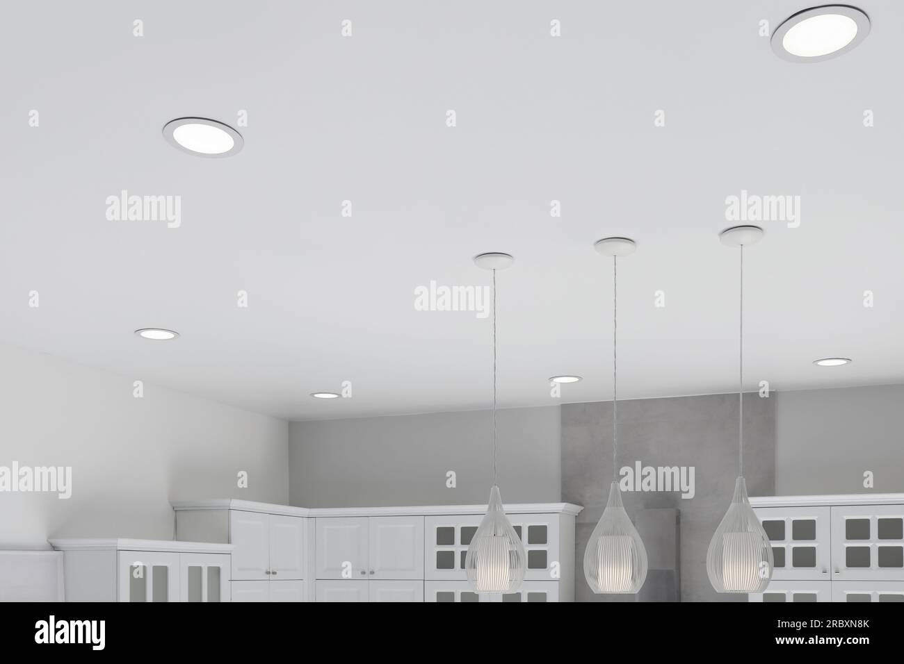 White ceiling with modern lighting in room Stock Photo - Alamy