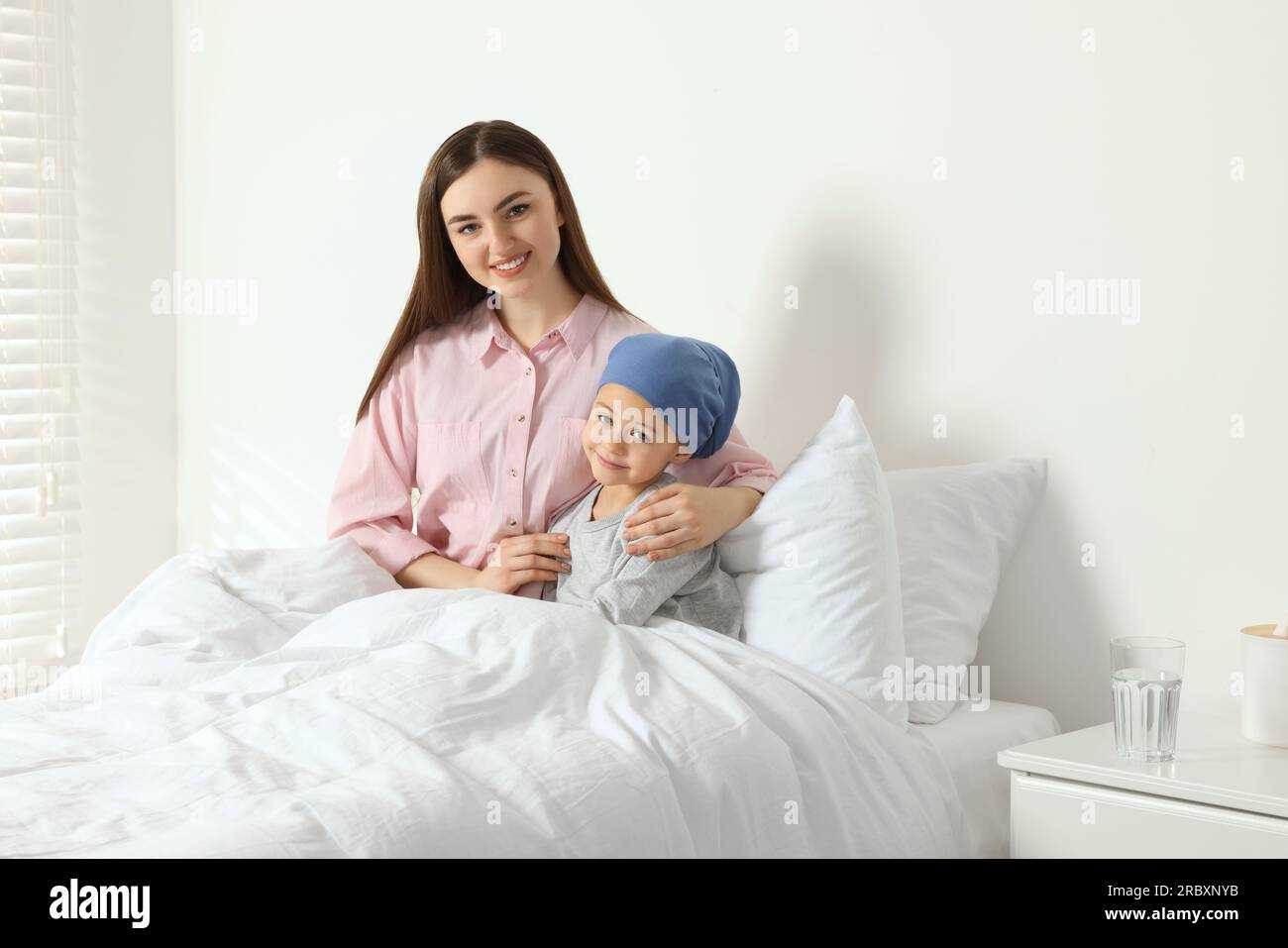 Childhood cancer. Mother and daughter in hospital Stock Photo - Alamy
