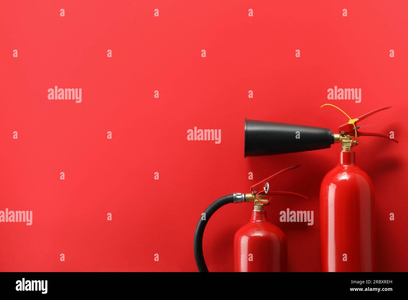 Fire extinguishers on red hi-res stock photography and images - Alamy