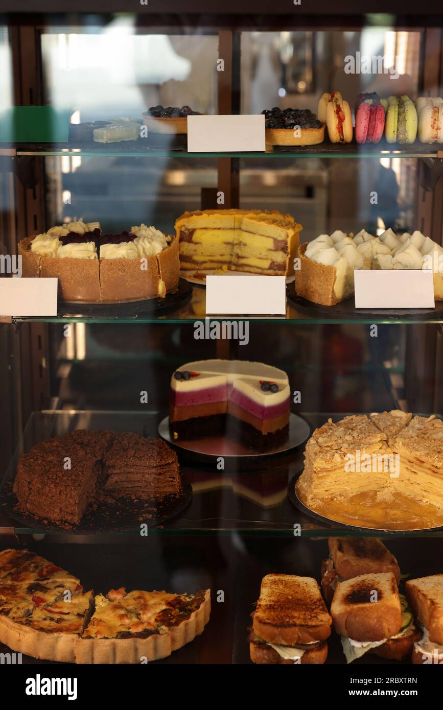Counter with delicious pastries and sandwiches in cafe Stock Photo - Alamy