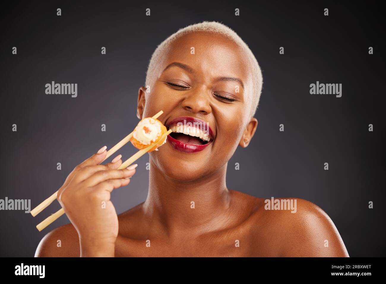 Face, laugh and woman with sushi and chopsticks in studio for healthy ...