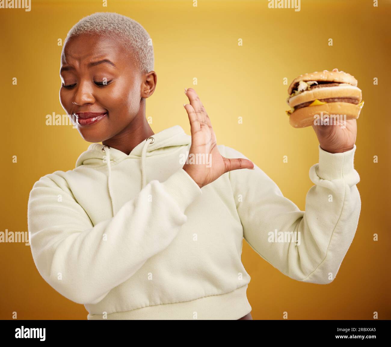 Diet, reject and fast food with woman or nutrition in yellow background ...