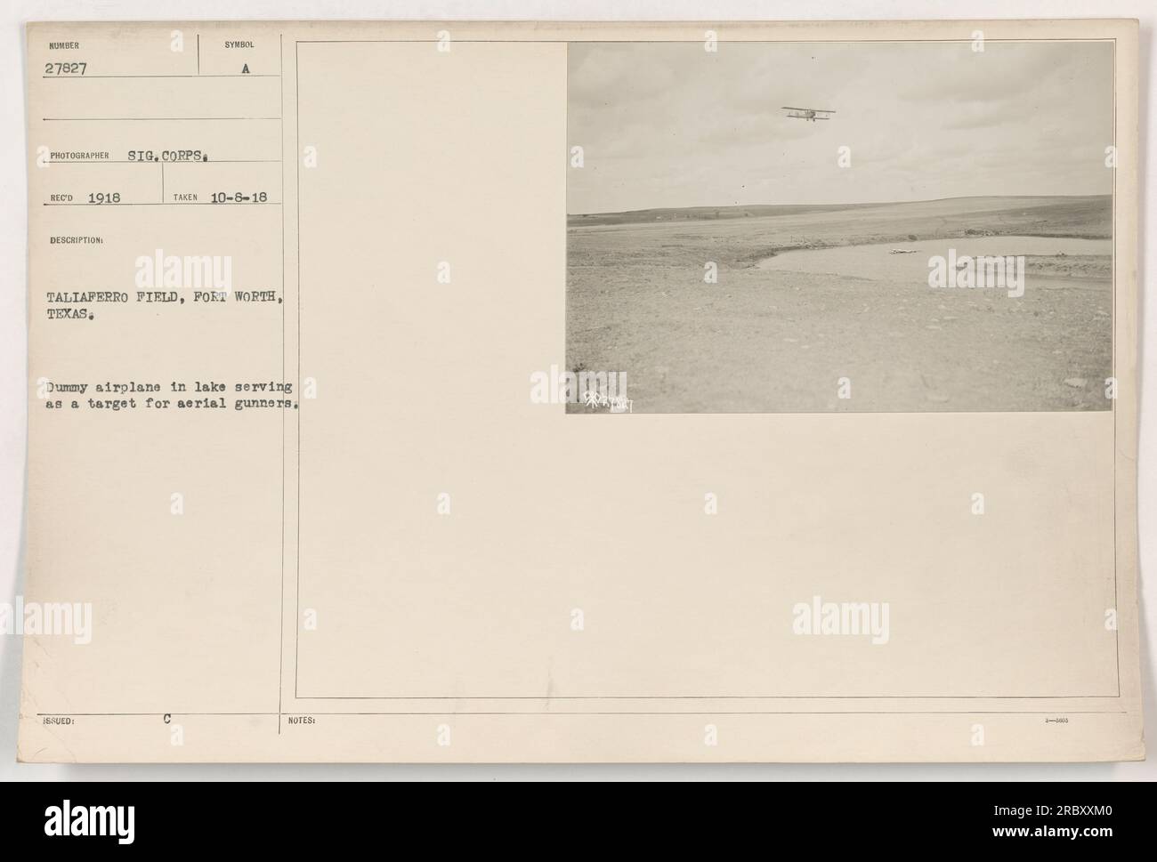 A dummy airplane serves as a target for aerial gunners at Taliaferro ...