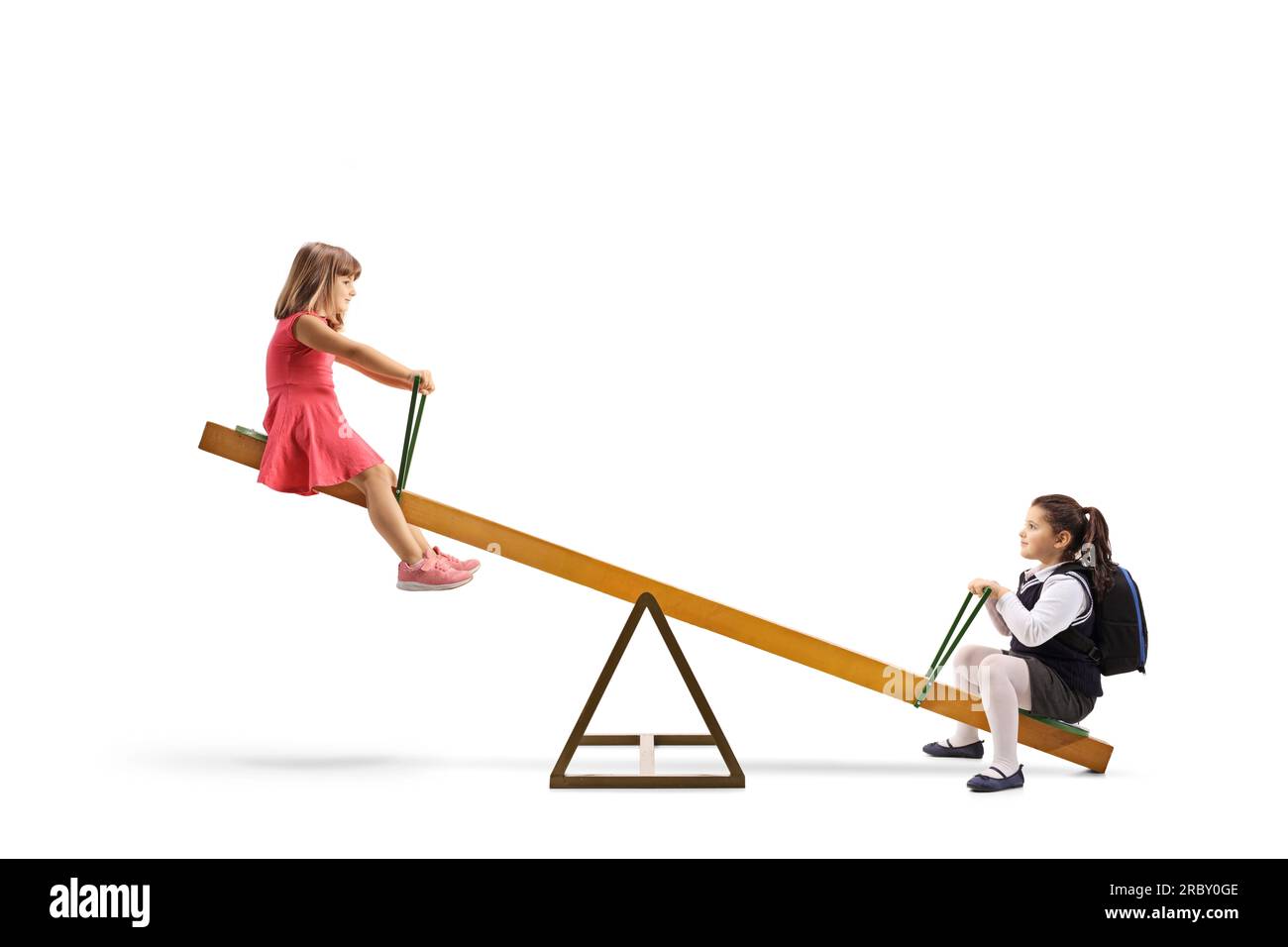 Two girls playing on a seesaw isolated on white background Stock Photo ...