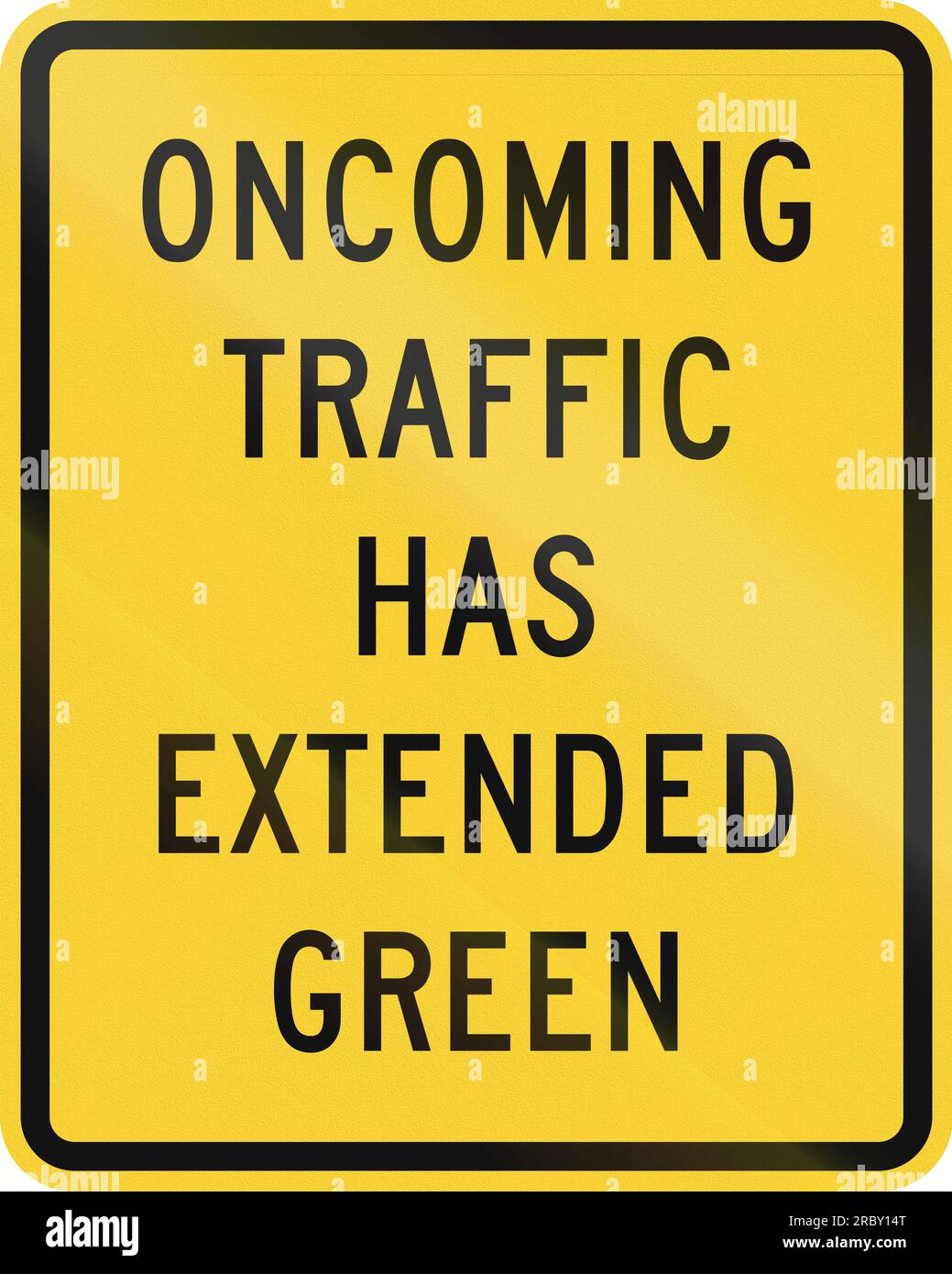 US road warning sign: Oncoming traffic has extended green Stock Photo ...