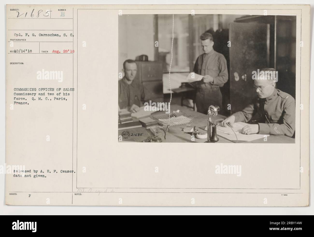 Cpl. F.G. Carnochan, an American soldier, stands with the commanding ...