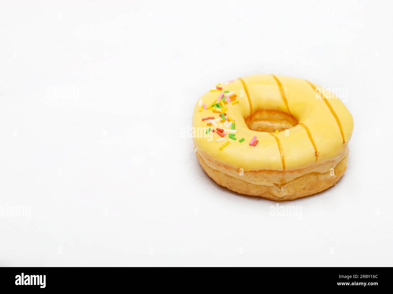 yellow donuts isolated on white background Stock Photo - Alamy