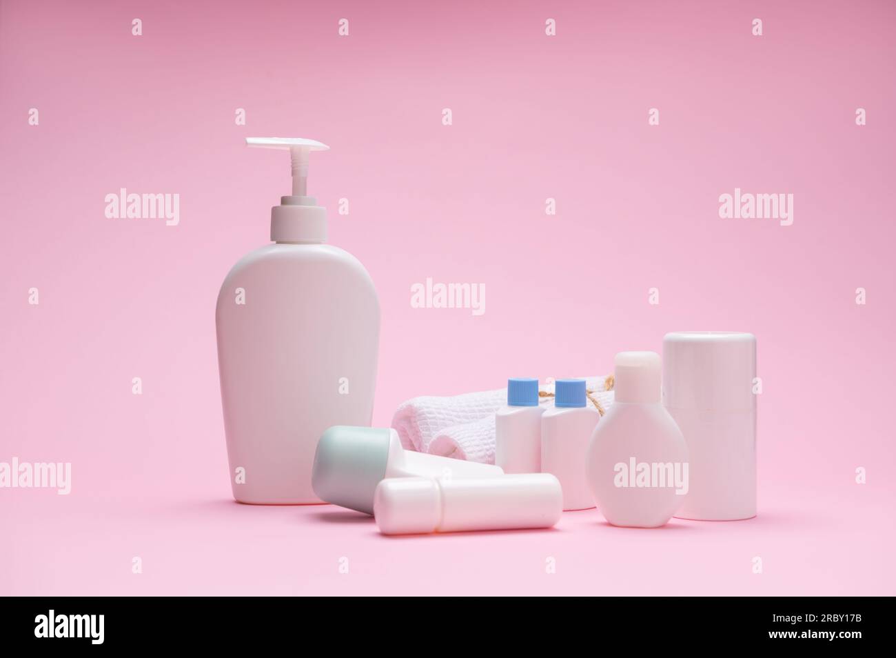 Still life composition with set of white test mockup bottles with body ...