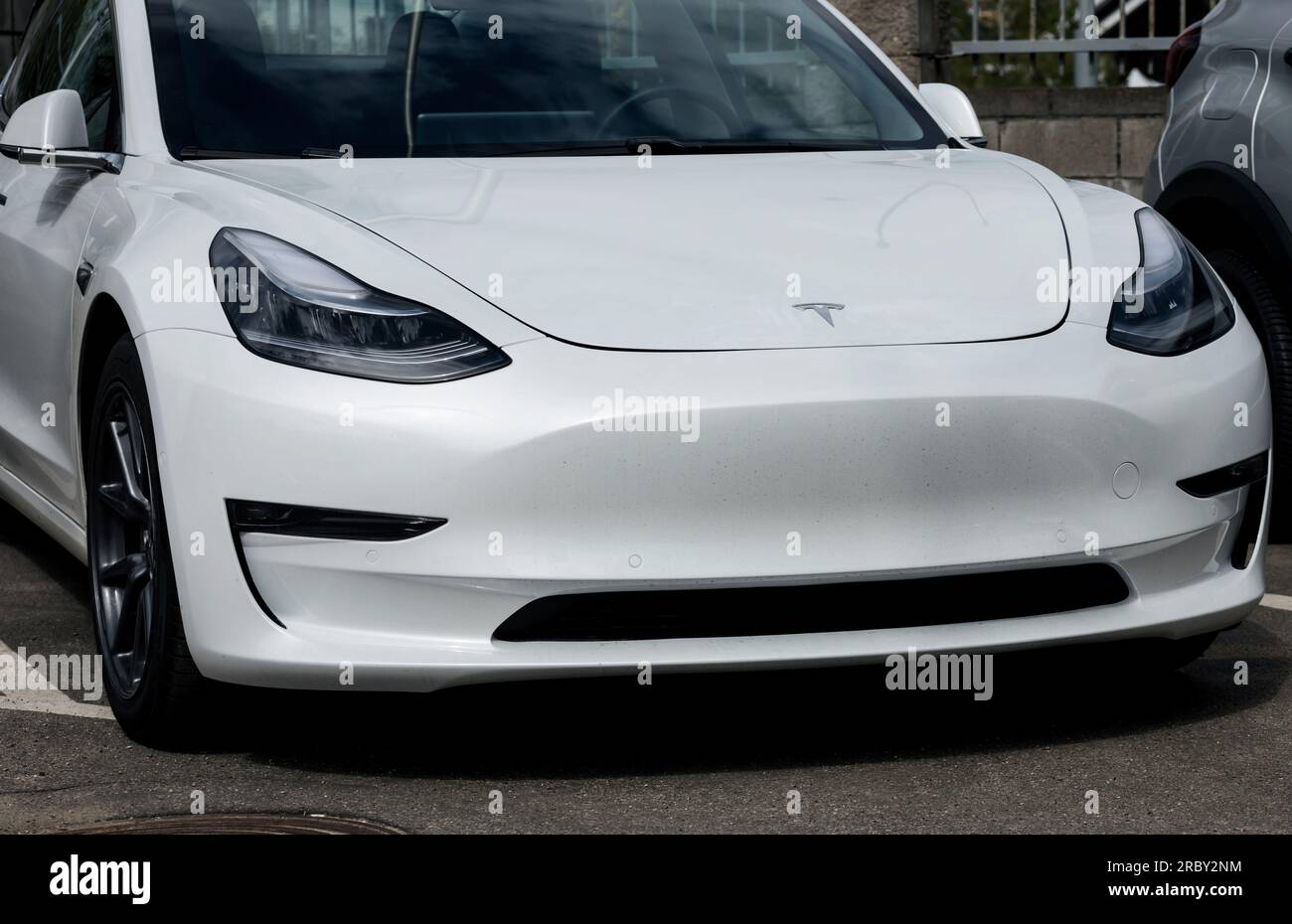 Minsk, Belarus, July 2023 - white electric Tesla Model 3. stylish ...