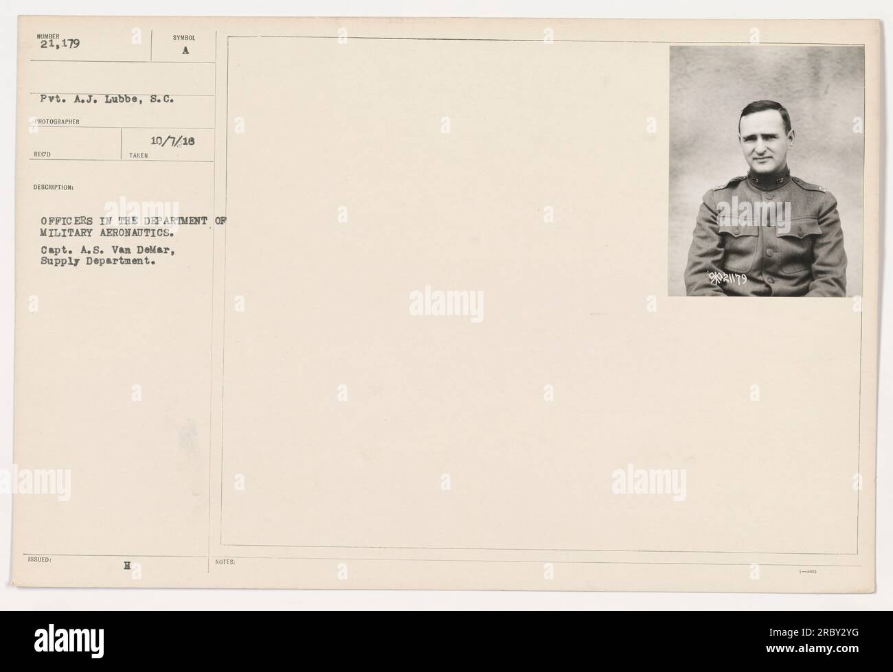 Pvt. A.J. Lubbe, S.C., is photographed receiving his official insignia ...