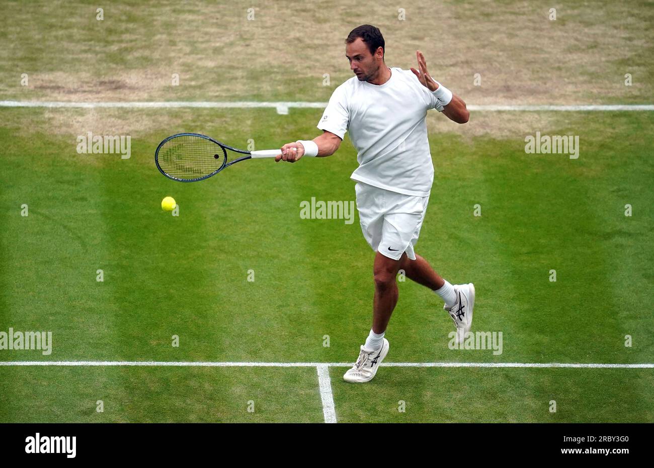 Roman Safiullin in action against Jannik Sinner during their gentlemen ...