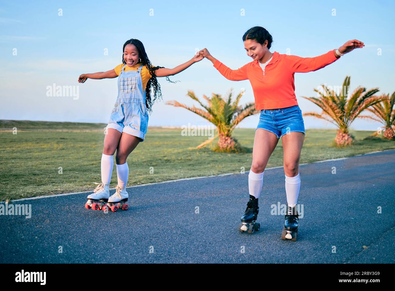 Holding hands, roller skates and friends on street for exercise ...