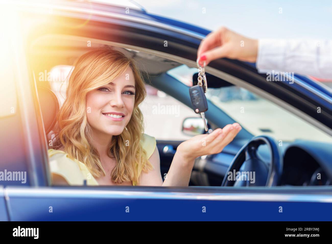 A woman's hand passes the key to the car Stock Photo - Alamy