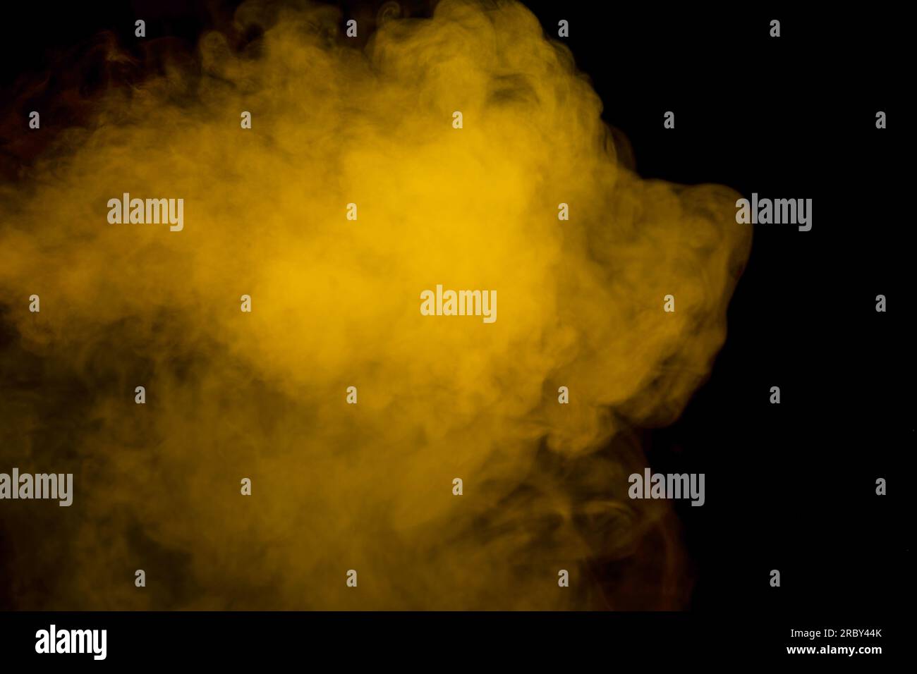 Yellow steam on a black background. Copy space Stock Photo - Alamy
