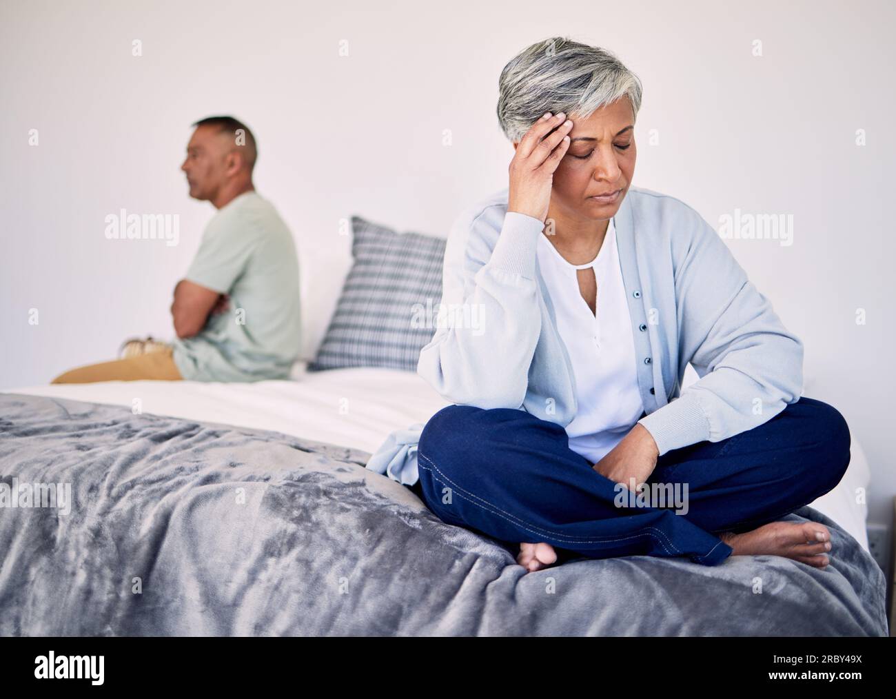 Angry, divorce and a senior couple in the bedroom for a fight, sad and ...