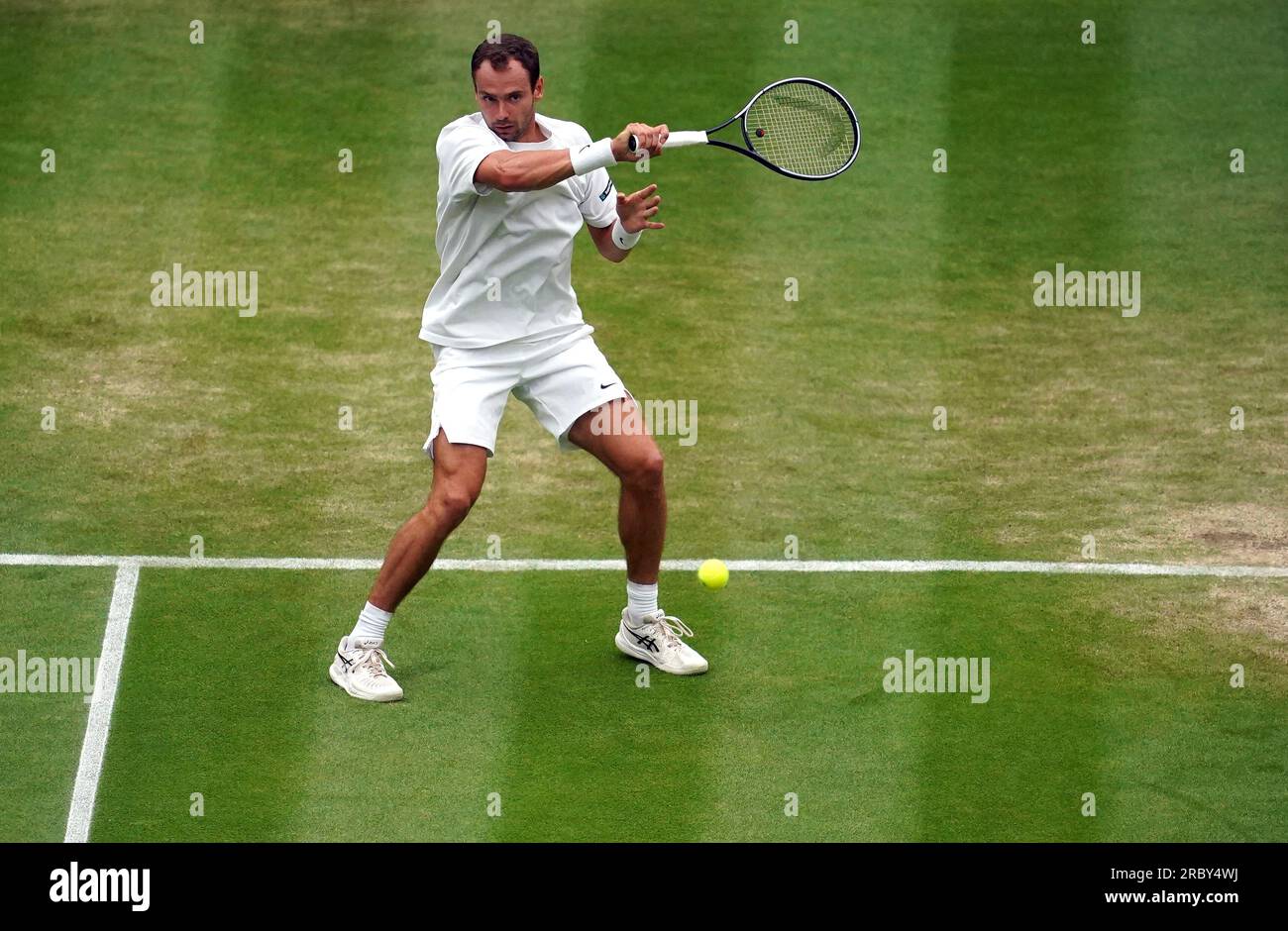Roman Safiullin in action against Jannik Sinner during their gentlemen ...