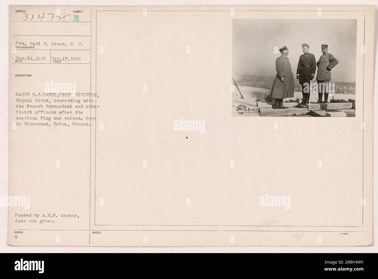 Title: "Major E.J. Hardy conversing with French officers after the ...