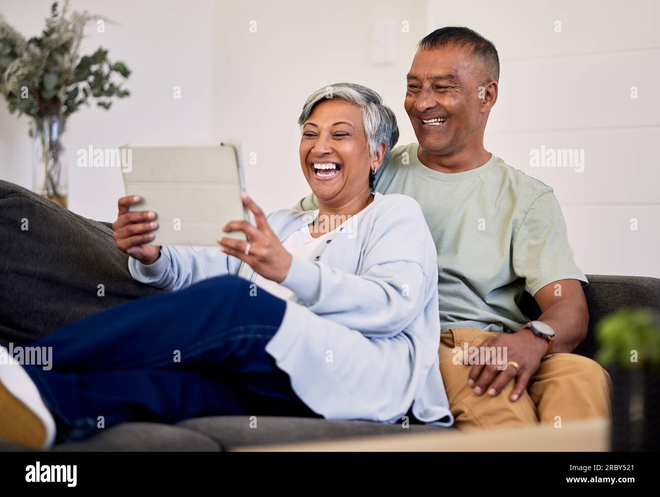 Love, tablet and senior couple laughing at funny social network meme ...