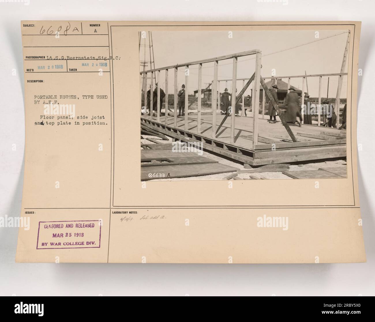 Group of American soldiers assembling portable houses, which were used ...