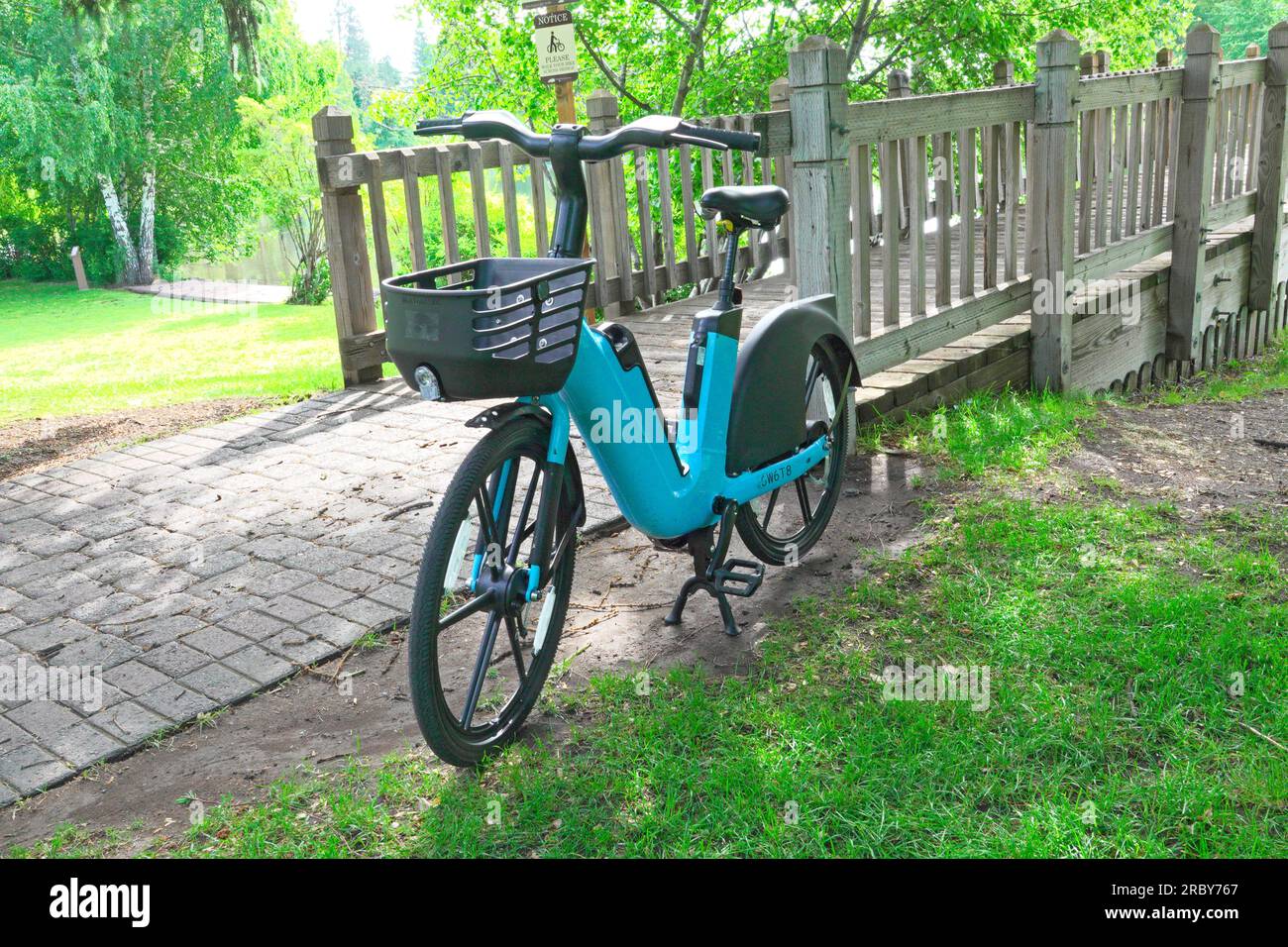 An electric rental bicycle at a rack waiting for a rider in a park in ...