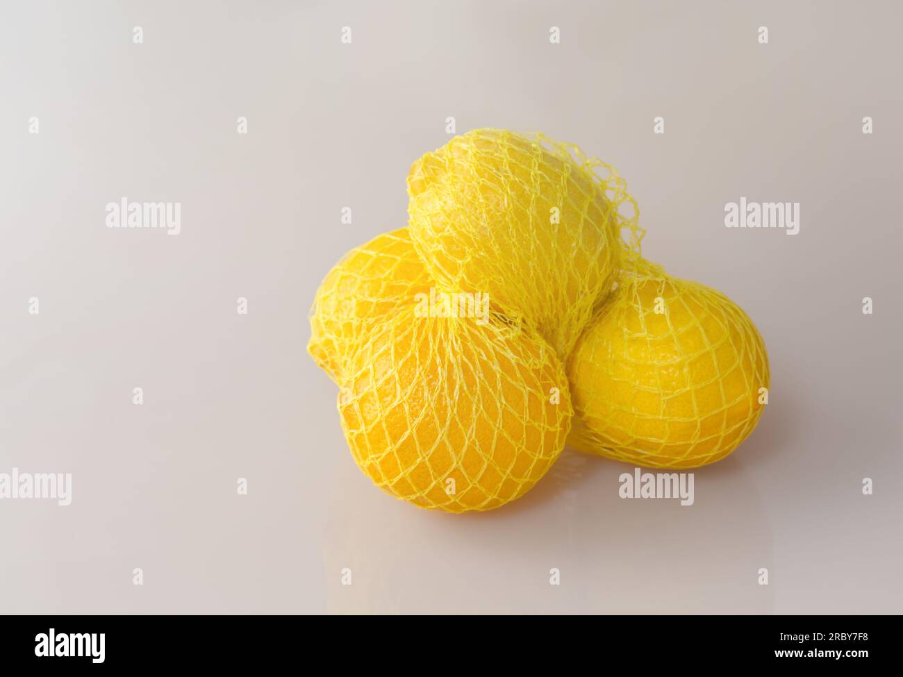 Lemon in a grid on a light background with copy space in a horizontal ...