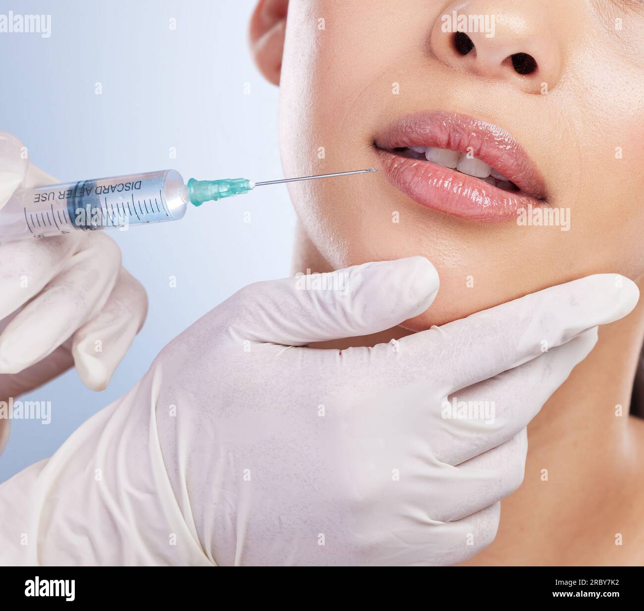 Lips, botox and plastic surgery with hands on the face of a woman for ...