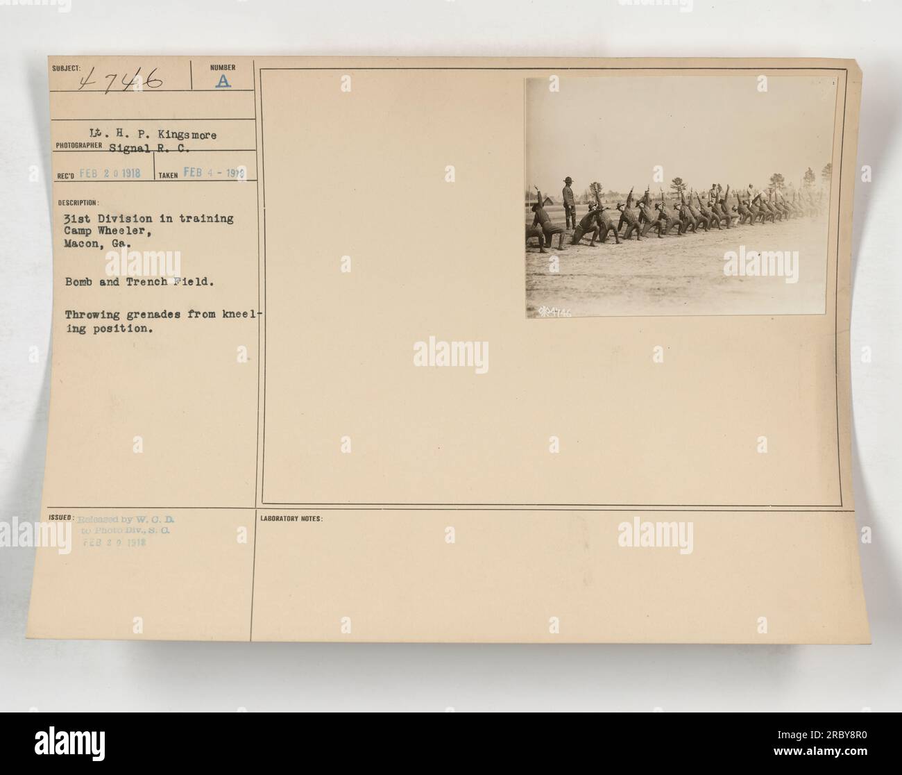 31st Division soldiers practicing throwing grenades from a kneeling ...