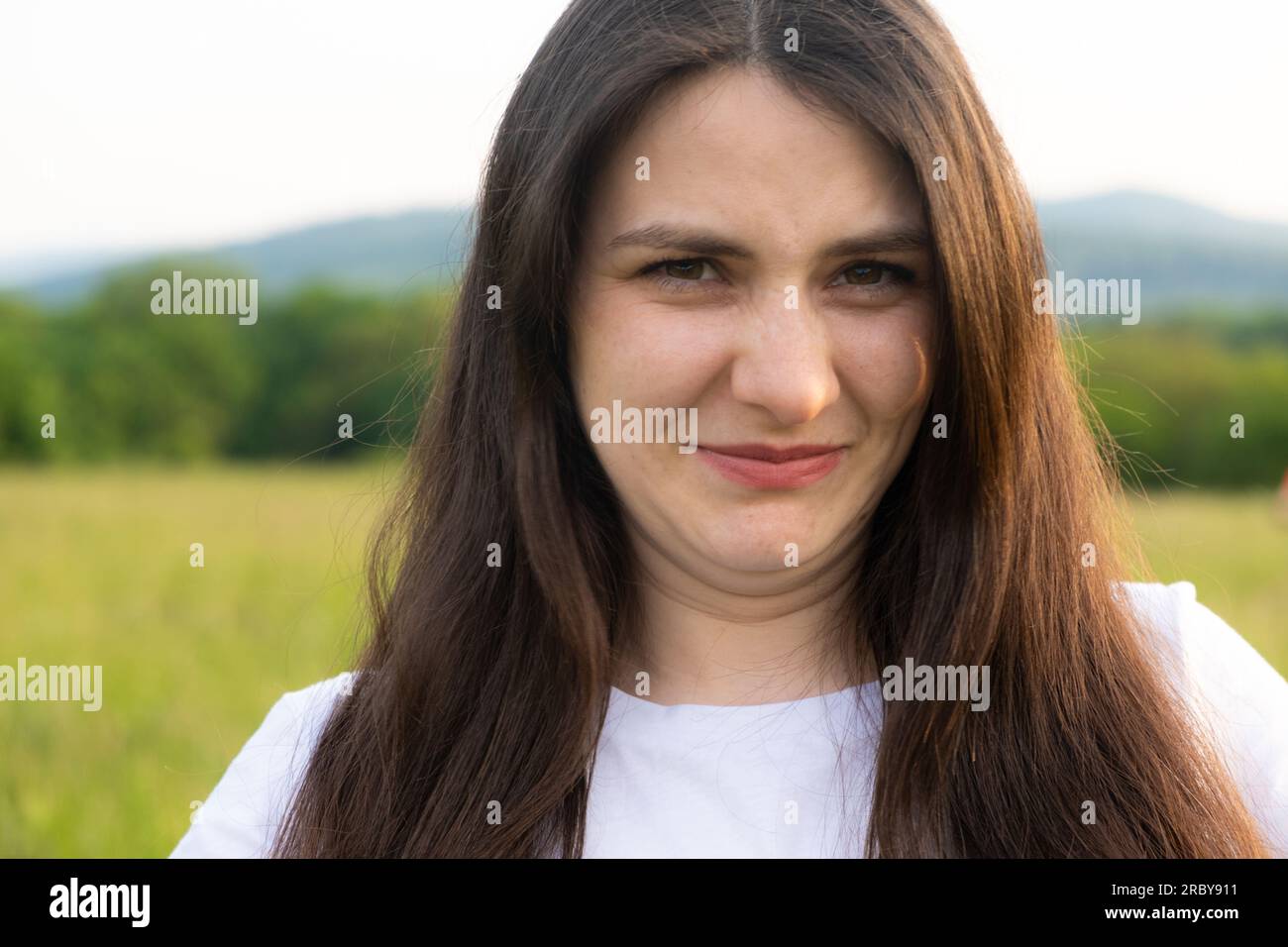 A squeamish woman looks at the camera in disgust Stock Photo - Alamy