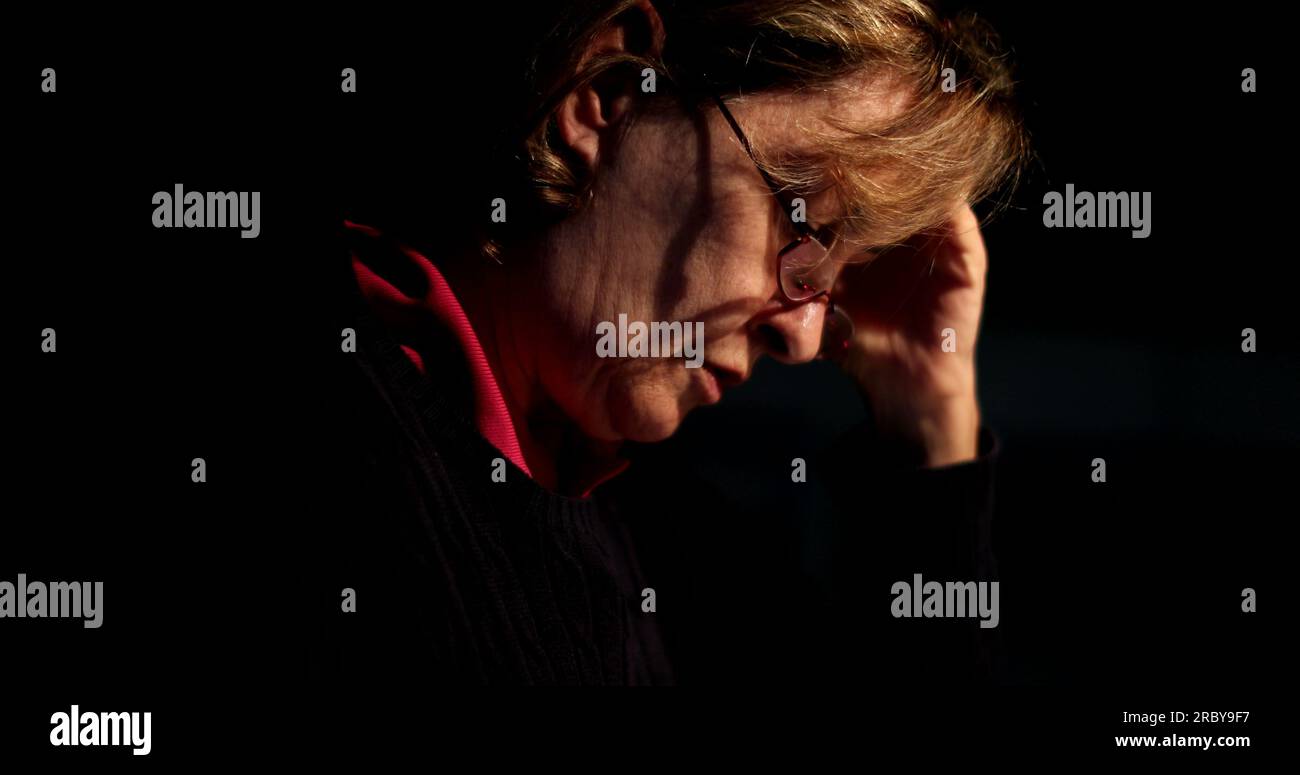 Pensive older woman writing notes hi-res stock photography and images ...