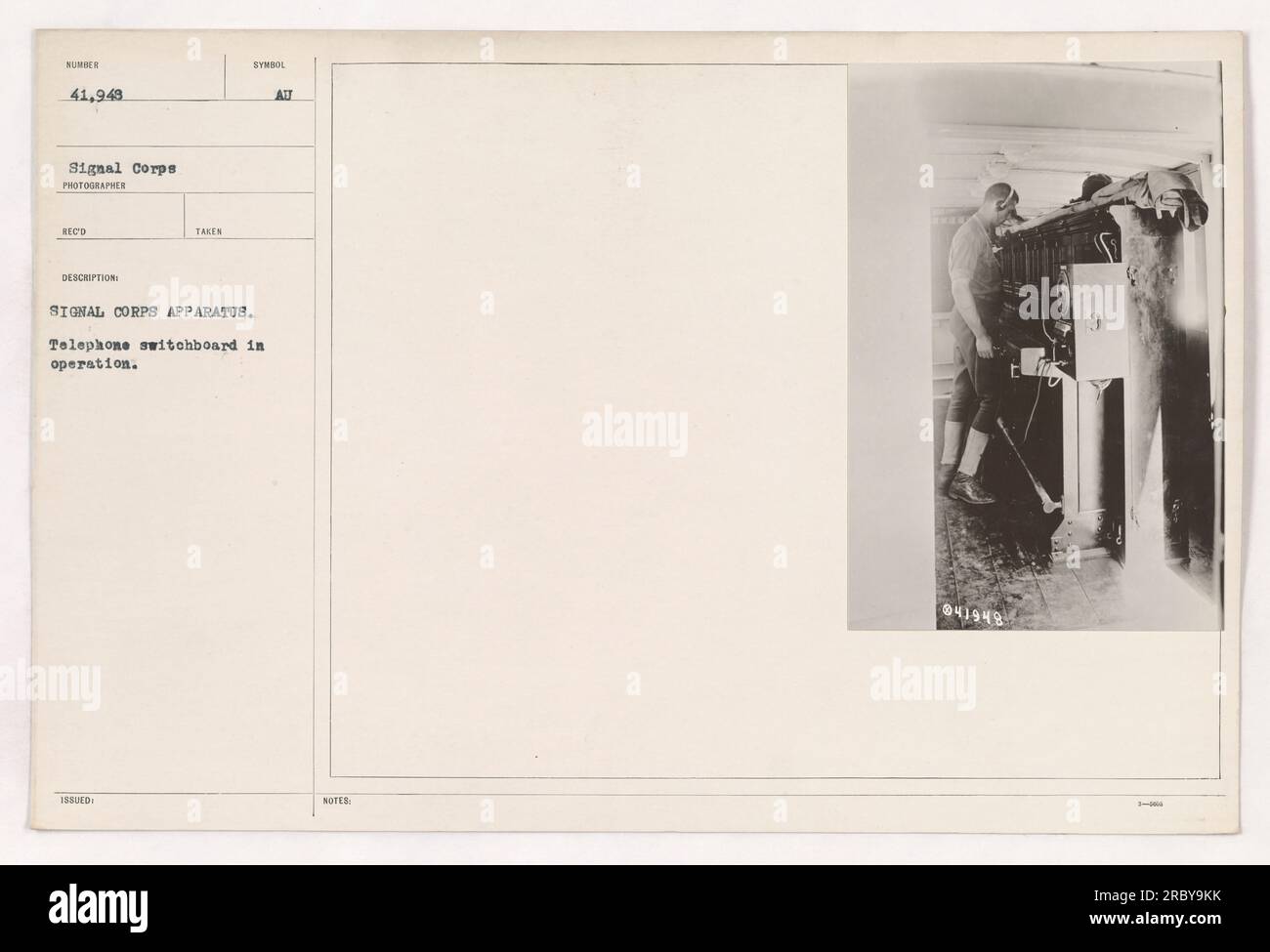 An American soldier operates a telephone switchboard during World War ...